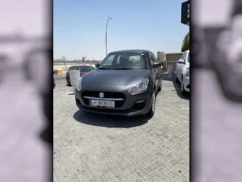 Suzuki Swift Grey Hatchback For Rent in Qatar