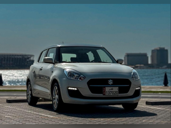 Suzuki Swift White Hatchback For Rent in Qatar